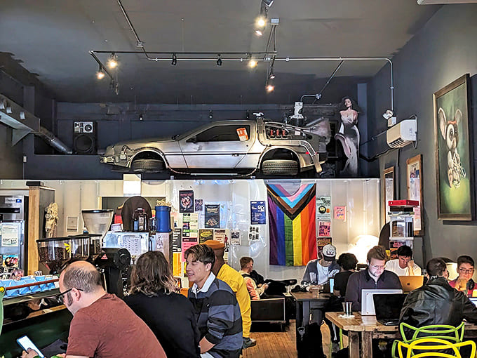 A diverse crowd of coffee lovers, students, and neighborhood regulars creates the vibrant community atmosphere that makes The Wormhole more than just a caf&eacute;.