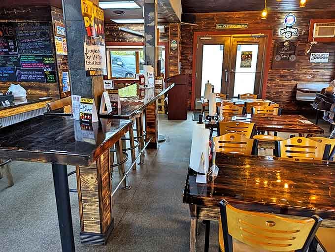 Smoke's dining room balances rustic charm with comfortable functionality, where wooden tables tell stories of countless satisfied meals past.