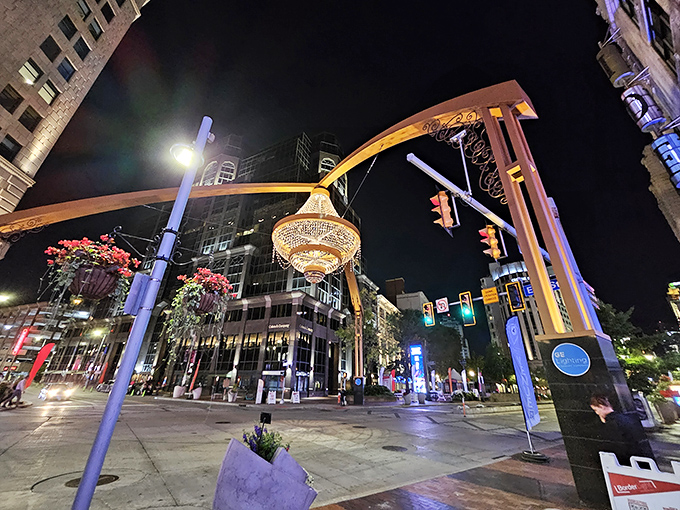 Night transforms the district into an urban wonderland, where the chandelier's warm glow turns ordinary evenings into special occasions.