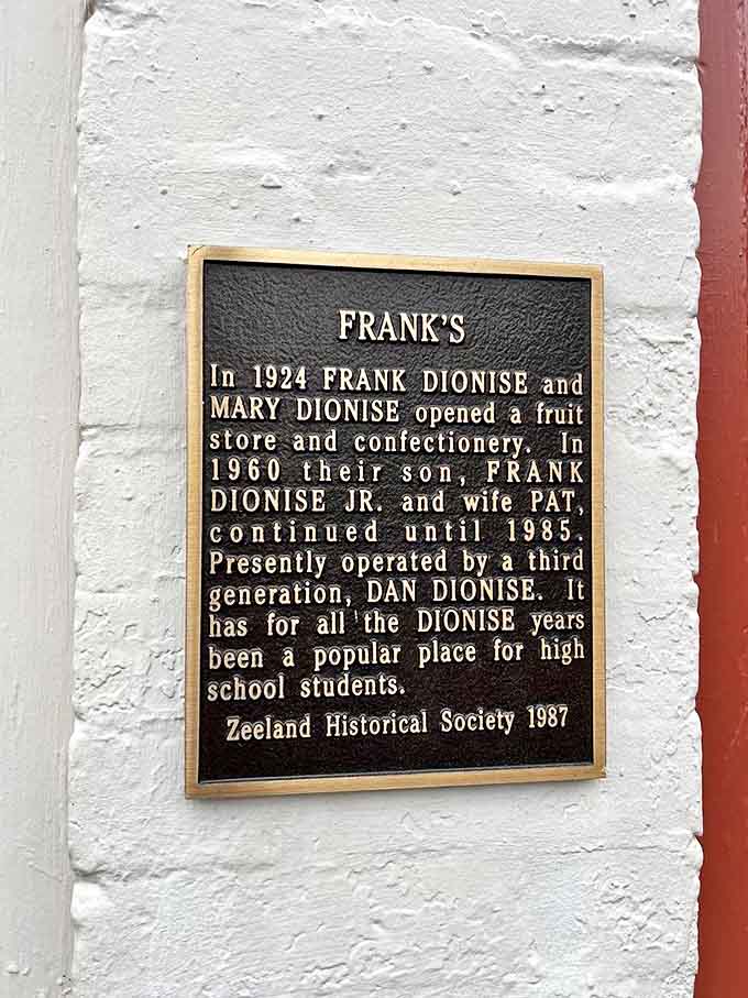 History: This plaque tells the story of a family legacy that began with fruit and confections and evolved into burger perfection.