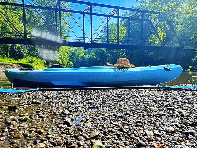 Kayakers gain a rare perspective from below, approaching the bridge as travelers might have a century ago.