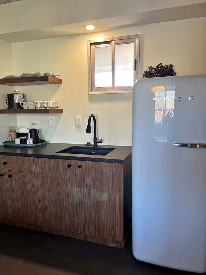 Clever kitchen design packs modern amenities into a space that maintains its mid-century aesthetic without sacrificing function.