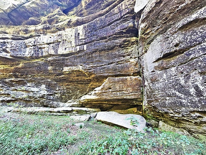 Massive rock overhangs provided shelter for early settlers and indigenous peoples, their histories etched into these ancient stones.