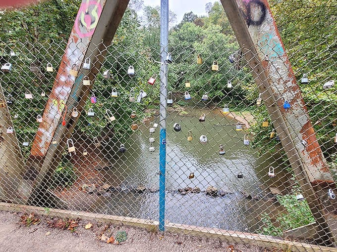 Love locks adorn the bridge near the tunnel, modern romantics adding their stories to this historic place.