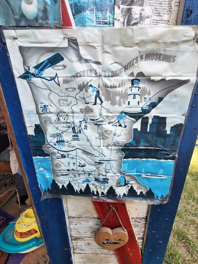 A weathered map of Minnesota's historic sites adorns this blue outhouse &ndash; a bathroom-based tour guide to the North Star State.