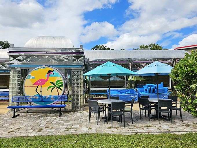 Outdoor seating where Florida's natural beauty complements your meal. That flamingo mural isn't just decoration&mdash;it's the restaurant's spirit animal basking in the sunshine.