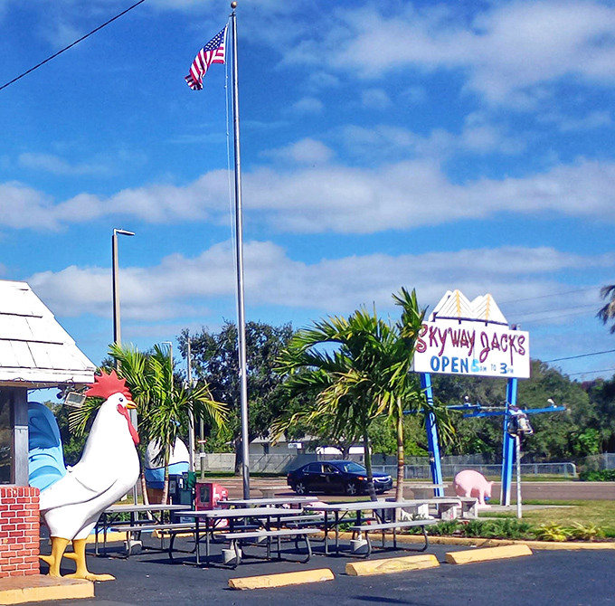 Outdoor seating under Florida skies, where the American flag waves over picnic tables ready for breakfast feasts.