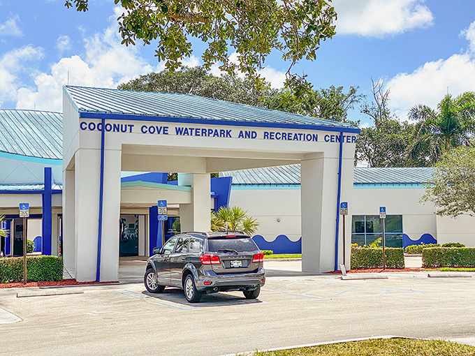 The welcoming entrance to Coconut Cove promises affordable aquatic adventures without the overwhelming crowds of commercial water parks.