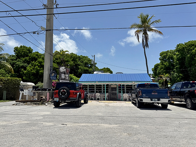 Florida sunshine bathes the exterior of this beloved Keys institution, where palm trees stand guard over countless seafood feasts and key lime memories.