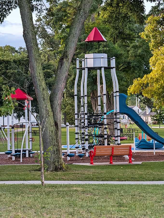 Trees frame the beach path like nature's own welcome arch, inviting you to leave your worries behind and embrace the kind of relaxation that only waterfront living provides.