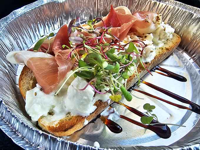 This prosciutto toast elevates breakfast to an art form, with salty meat and creamy cheese playing a delicious duet.