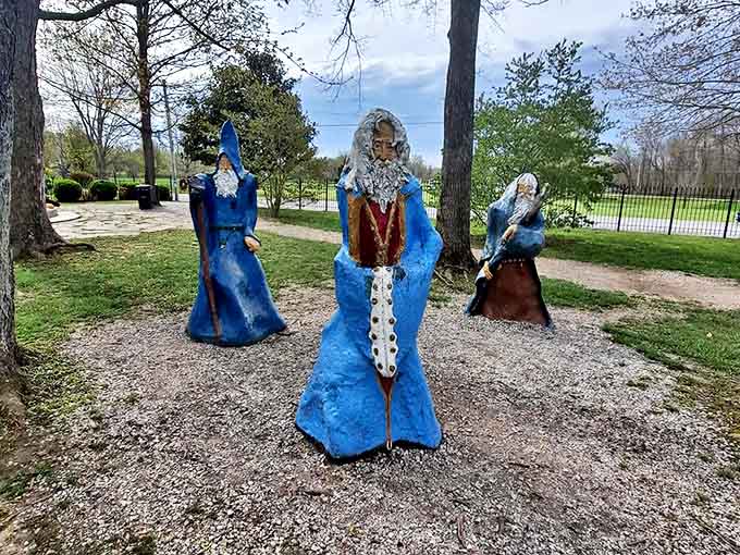 Blue-robed wizards stand in silent conference, their mysterious expressions sparking countless imaginative stories for young visitors.