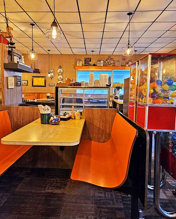 Vibrant orange booth seating invites diners to settle in for serious eating in a space that feels like Minnesota's collective dining room.