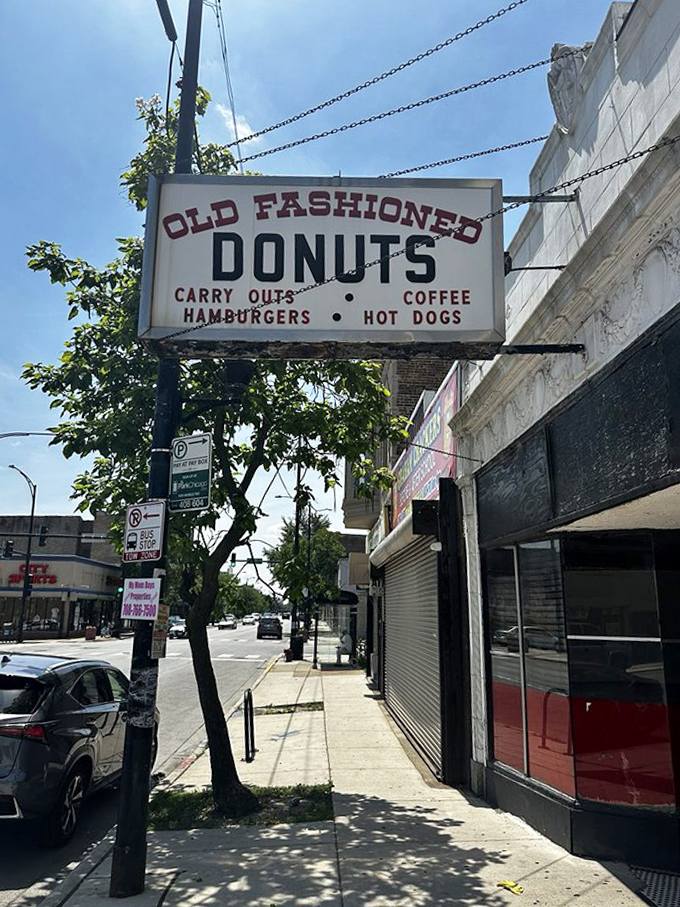 That vintage sign has become a beacon for donut lovers&mdash;promising "Old Fashioned Donuts" alongside burgers, hot dogs, and coffee.