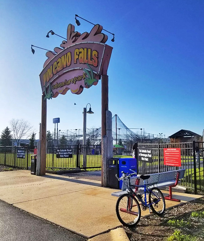 The distinctive Volcano Falls sign welcomes visitors, standing tall against the Illinois sky like a beacon of family fun.