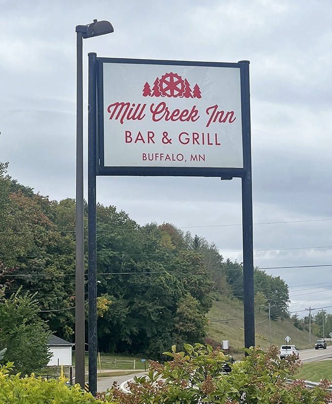The Mill Creek Inn sign stands as a beacon for hungry travelers, promising authentic Minnesota hospitality and memorable meals ahead.