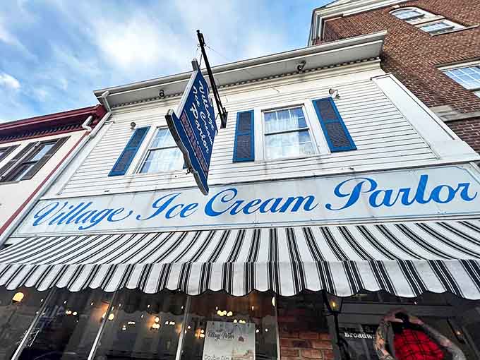 The blue and white signage stands as a beacon of sweetness, promising a temporary escape from the modern world's hustle and bustle.