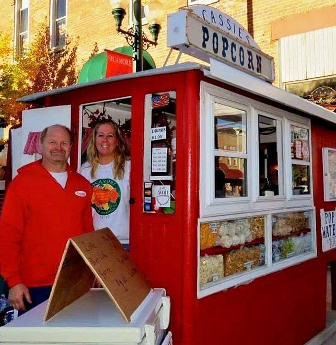 The cheerful red stand with its simple white trim stands as a colorful reminder that some traditions are worth preserving in our fast-paced world.