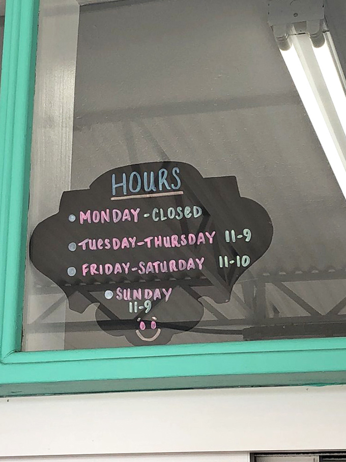 The shell-shaped hours sign feels like insider information &ndash; a secret schedule for those in the know about Palm Harbor's best-kept secret.