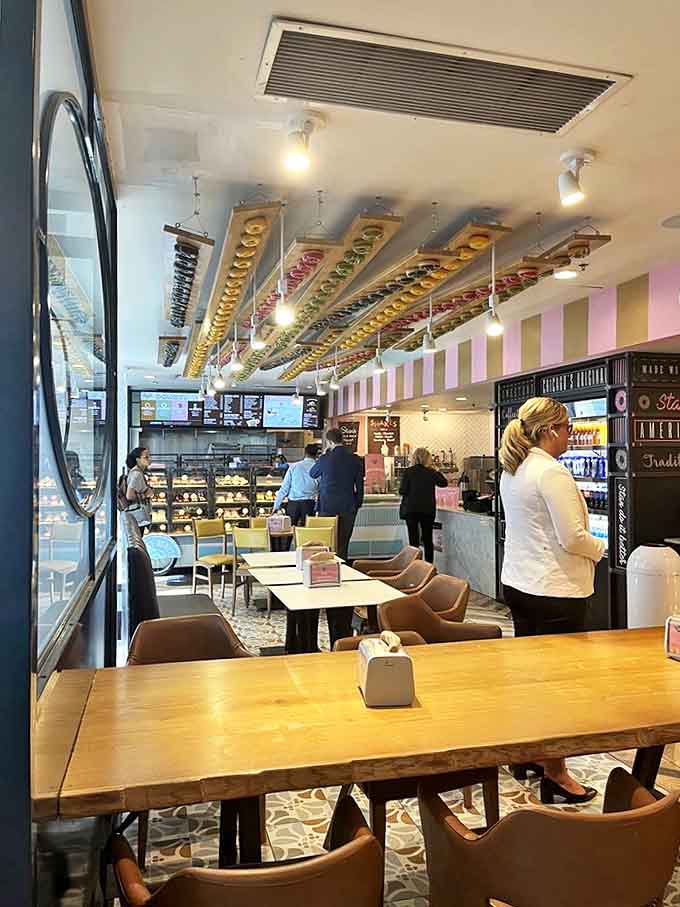 Tables await the lucky few who score seats in this donut paradise, where strangers become friends over shared sugar highs and coffee revelations.