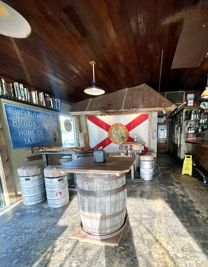 The taproom showcases Florida's state pride alongside barrels repurposed as tables – rustic ingenuity that would make early settlers proud.