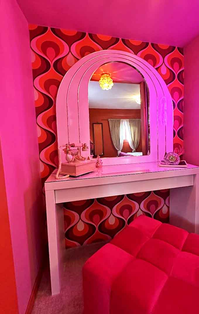 This vanity area isn't just functional &ndash; it's a pink-hued time machine where you half expect a rotary phone call from a 1960s fashion magazine editor.