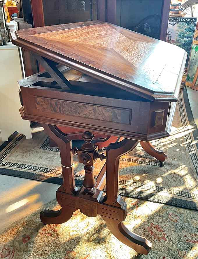 This Victorian architect's drafting table speaks to an era of precision craftsmanship, its adjustable top and intricate base designed for creating blueprints by hand.