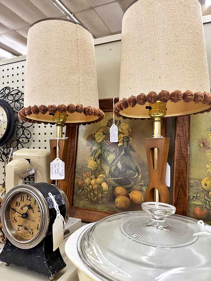 These mid-century lamps with their original pom-pom trimmed shades are just waiting to cast a warm glow in some lucky buyer's living room.