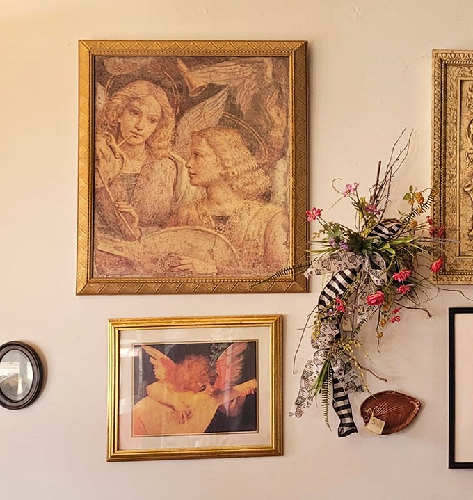 Vintage artwork and thoughtful decorations transform simple walls into a gallery celebrating both angels and the art of baking.