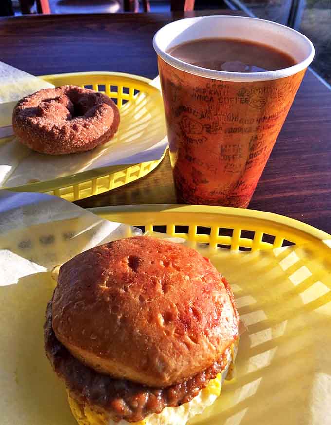 A perfect pairing: robust coffee in an unpretentious cup alongside donuts that don't need fancy names to be extraordinary.