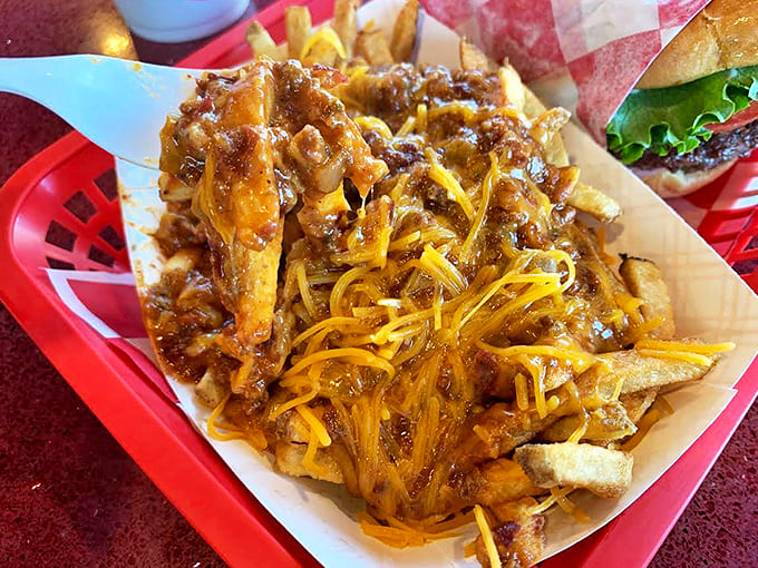 Chili Cheese Fries: A mountain of crispy fries smothered in hearty chili and melted cheese &ndash; technically a side dish, practically a meal.