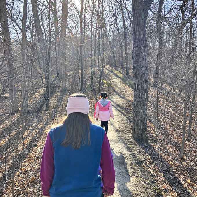 Winter transforms the trail into a monochrome masterpiece, where every breath becomes visible art and silence has texture.