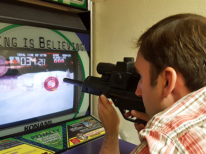 The intense concentration of a player lining up the perfect shot proves some gaming experiences simply can't be replicated on a smartphone.