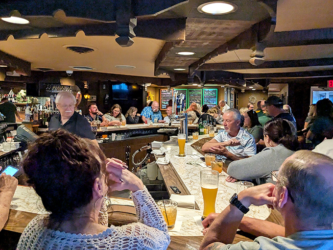 The bar area buzzes with energy as locals and visitors alike gather for pre-dinner drinks and lively conversation.