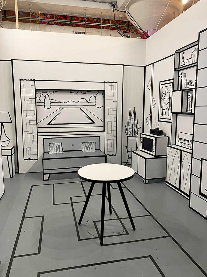 This black and white room makes you feel like you've stepped inside a comic book, where even the furniture looks hand-drawn.