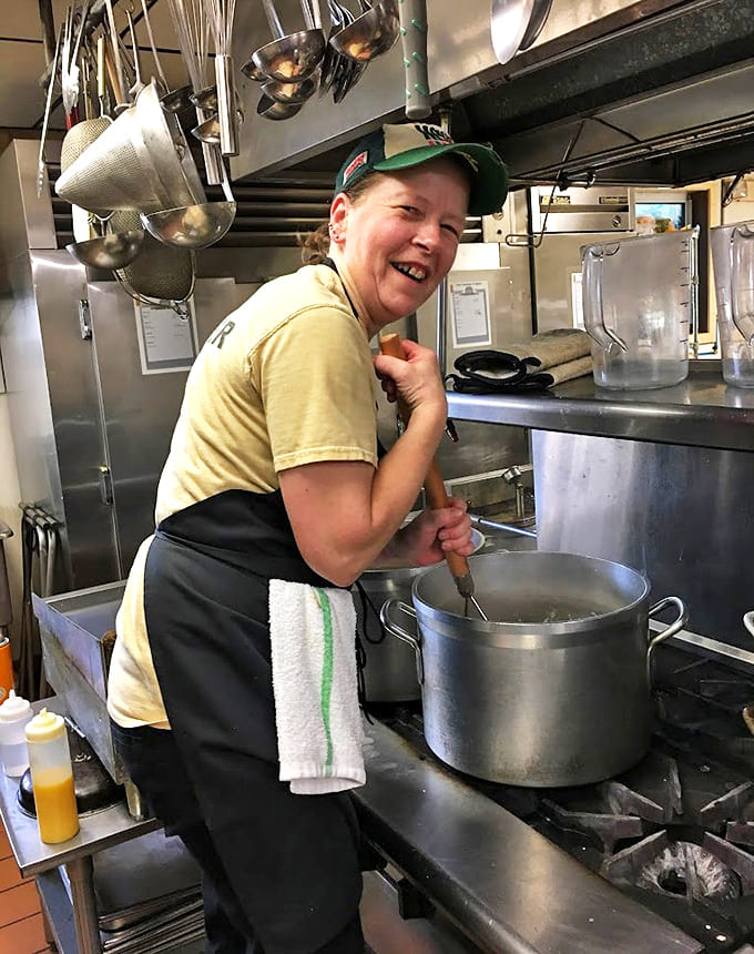 Skilled staff members navigate the busy space with practiced efficiency, turning out plate after plate of breakfast perfection.