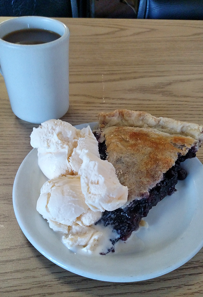 Blueberry pie with ice cream melting alongside &ndash; the kind of dessert that makes you close your eyes and momentarily forget your troubles.
