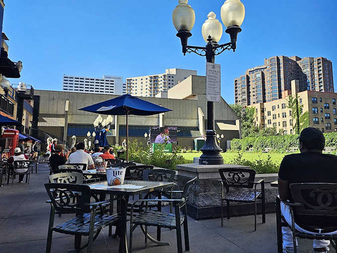 The outdoor patio offers a perfect vantage point for people-watching while enjoying a pint, with the Minneapolis skyline creating a stunning backdrop.
