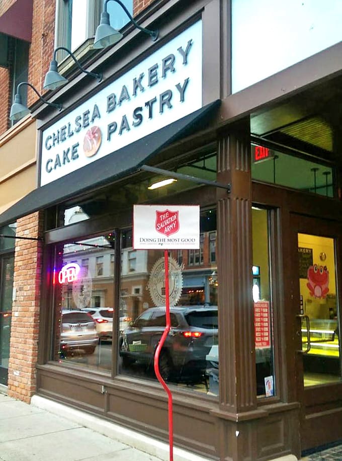 The welcoming storefront with its "OPEN" sign glowing in the window promises a sweet escape from everyday worries.