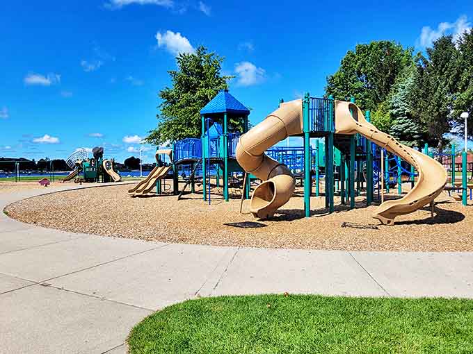 Childhood laughter echoes across Ludington's playgrounds, where vacation friendships form in the space of a slide ride.