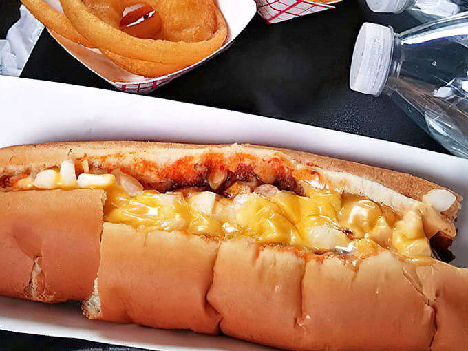 The chili cheese dog in its natural habitat – a symphony of savory chili, melty cheese and snappy hot dog that's worth every napkin it requires.