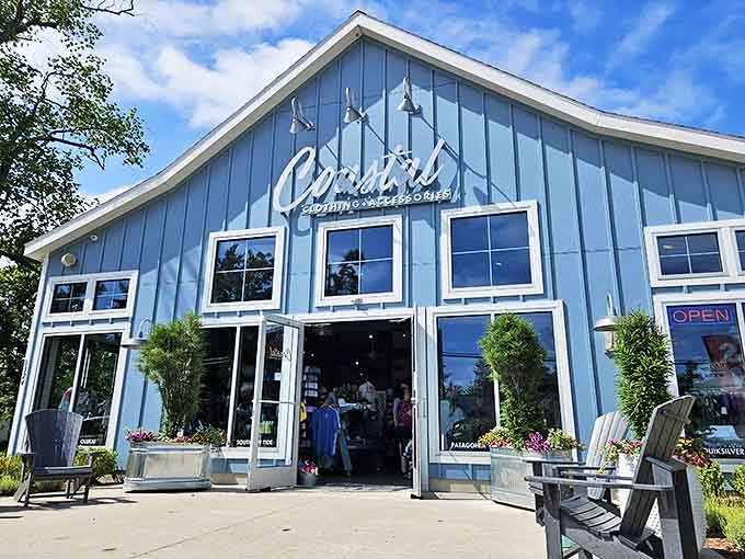 Coastal's bright blue exterior houses treasures for lake lovers who appreciate quality over mass-produced souvenirs.