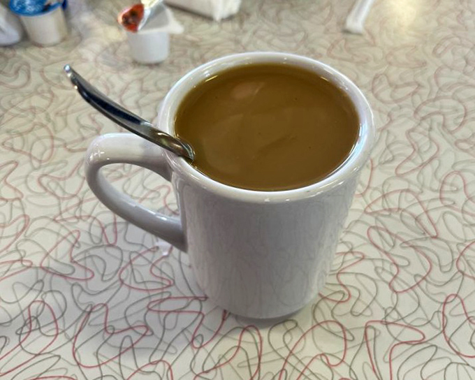 The humble coffee mug &ndash; unassuming vessel of liquid motivation that keeps Chase's conversations flowing and mornings bearable.