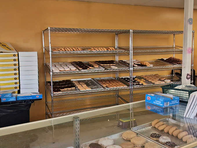 Behind the scenes, where donut dreams come true &ndash; racks of freshly made treasures waiting to meet their destiny in hungry hands.