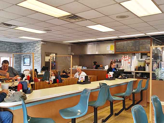 Front-row tickets to the culinary choreography, where hot dog artisans practice their craft with practiced precision.