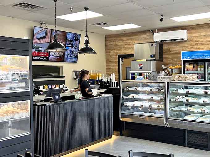Behind the counter, where breakfast magic happens, with Hamm's beer signage nodding to Minnesota heritage while coffee equipment stands ready for action.