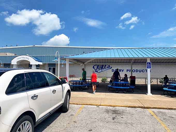 Covered outdoor seating provides shelter for the serious work of tackling those massive scoops, a strategic battlefield for the war against melting.