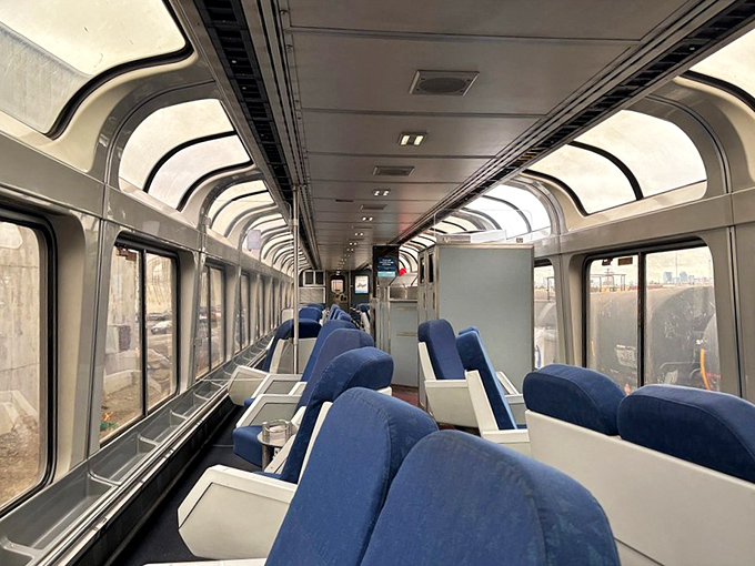 Enjoy wide windows, comfy seats, and peaceful views aboard the Empire Builder as it glides through the charming landscapes near Tomah, Wisconsin.