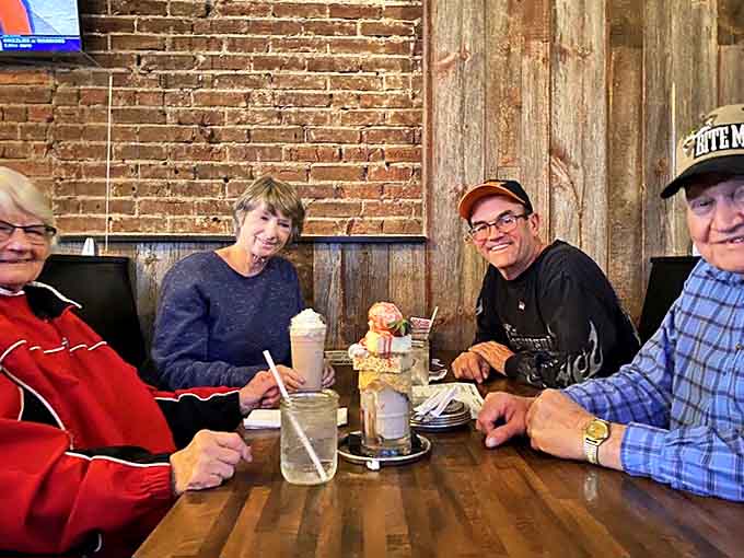 Happy diners sharing milkshakes and memories &ndash; the true measure of Crusade's success isn't just in the food but in the connections made around their wooden tables.