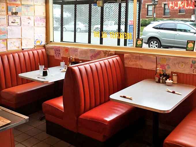 Cherry-red booths invite diners to settle in and stay awhile – these seats have cradled generations of satisfied breakfast enthusiasts.